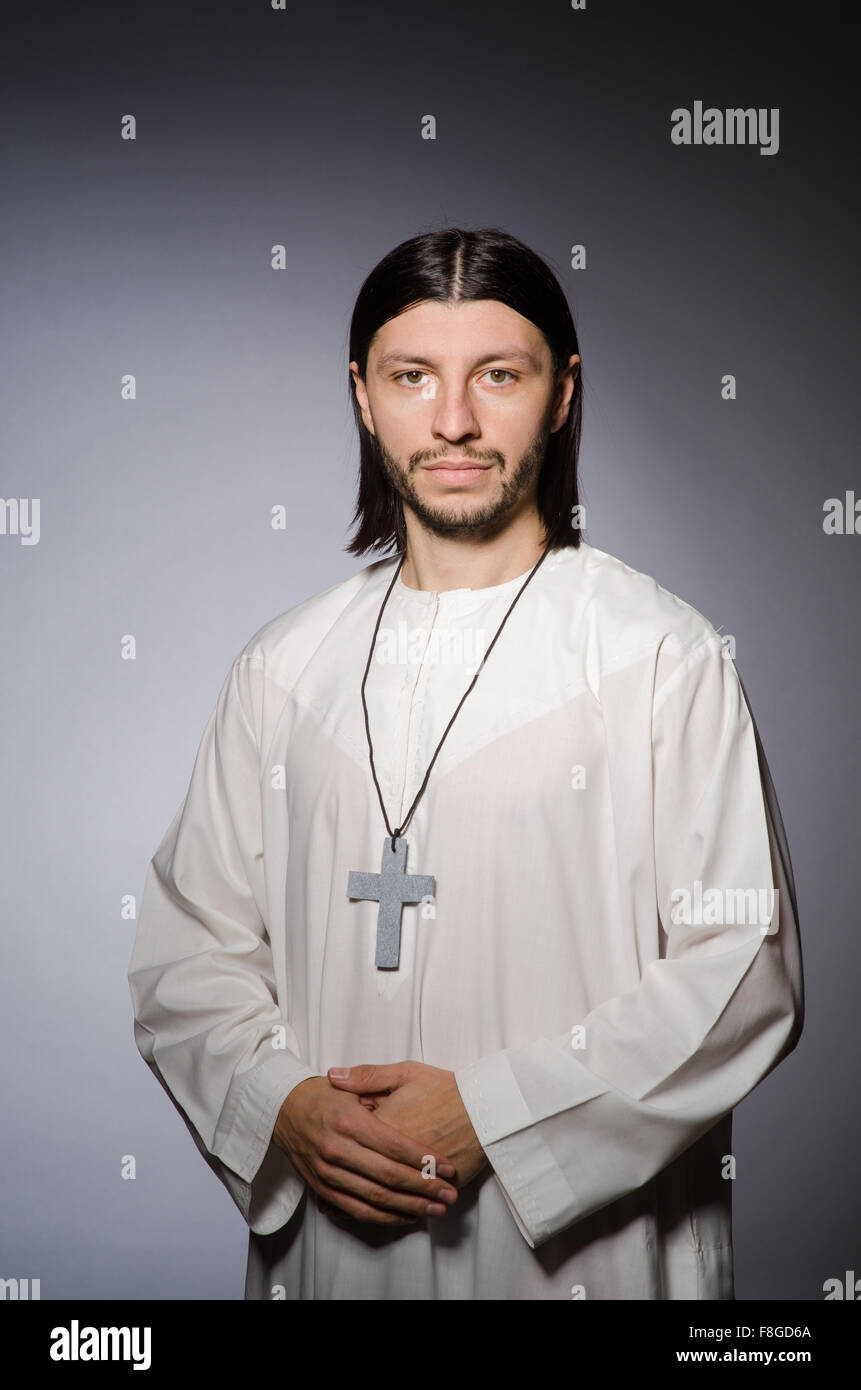 Priest man in religious concept Stock Photo - Alamy