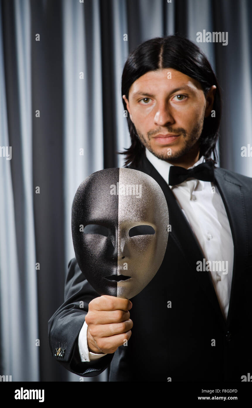Funny concept with theatrical mask Stock Photo - Alamy