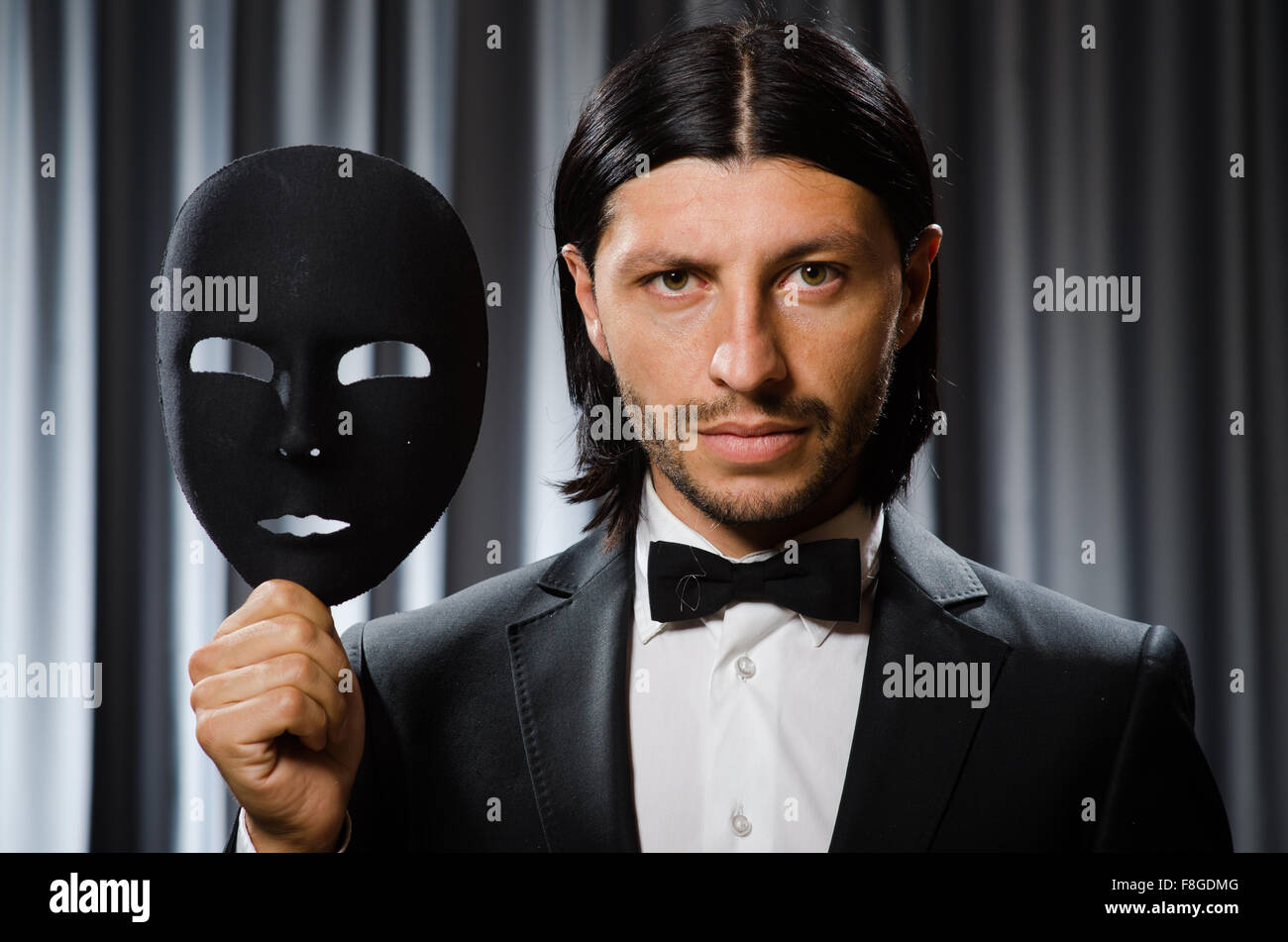 Funny concept with theatrical mask Stock Photo - Alamy
