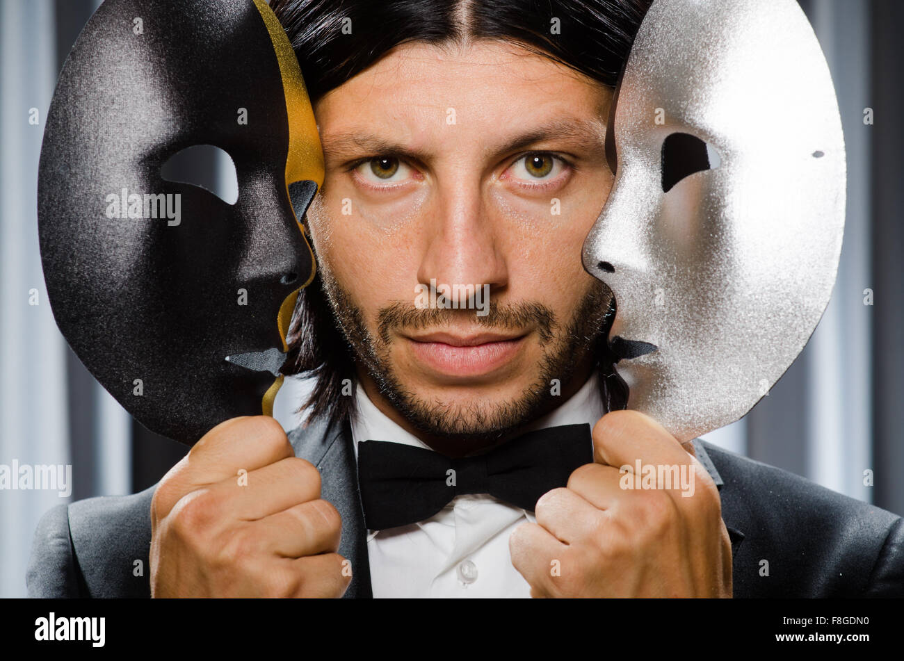 Funny concept with theatrical mask Stock Photo - Alamy