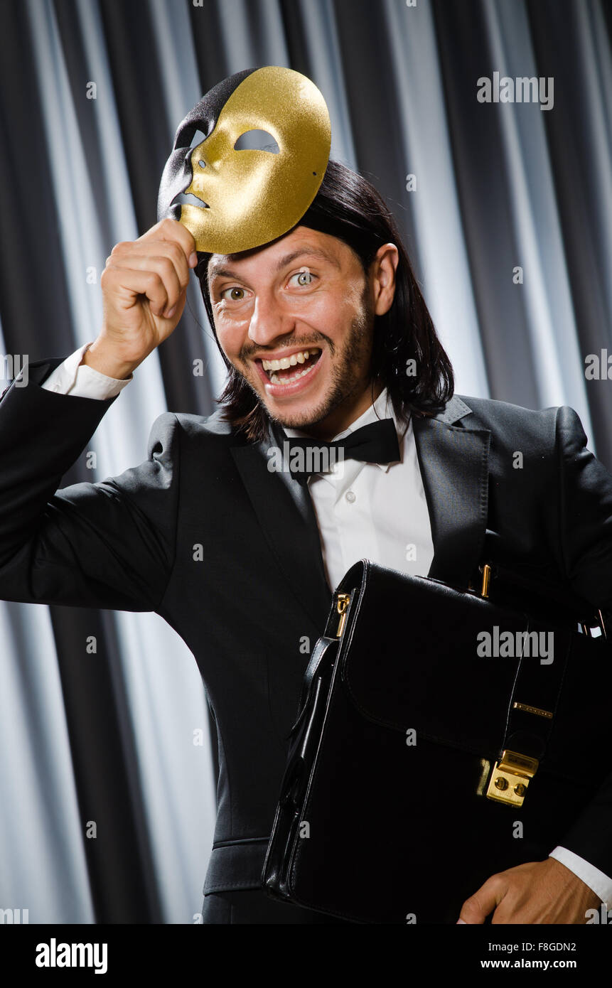 Funny concept with theatrical mask Stock Photo - Alamy