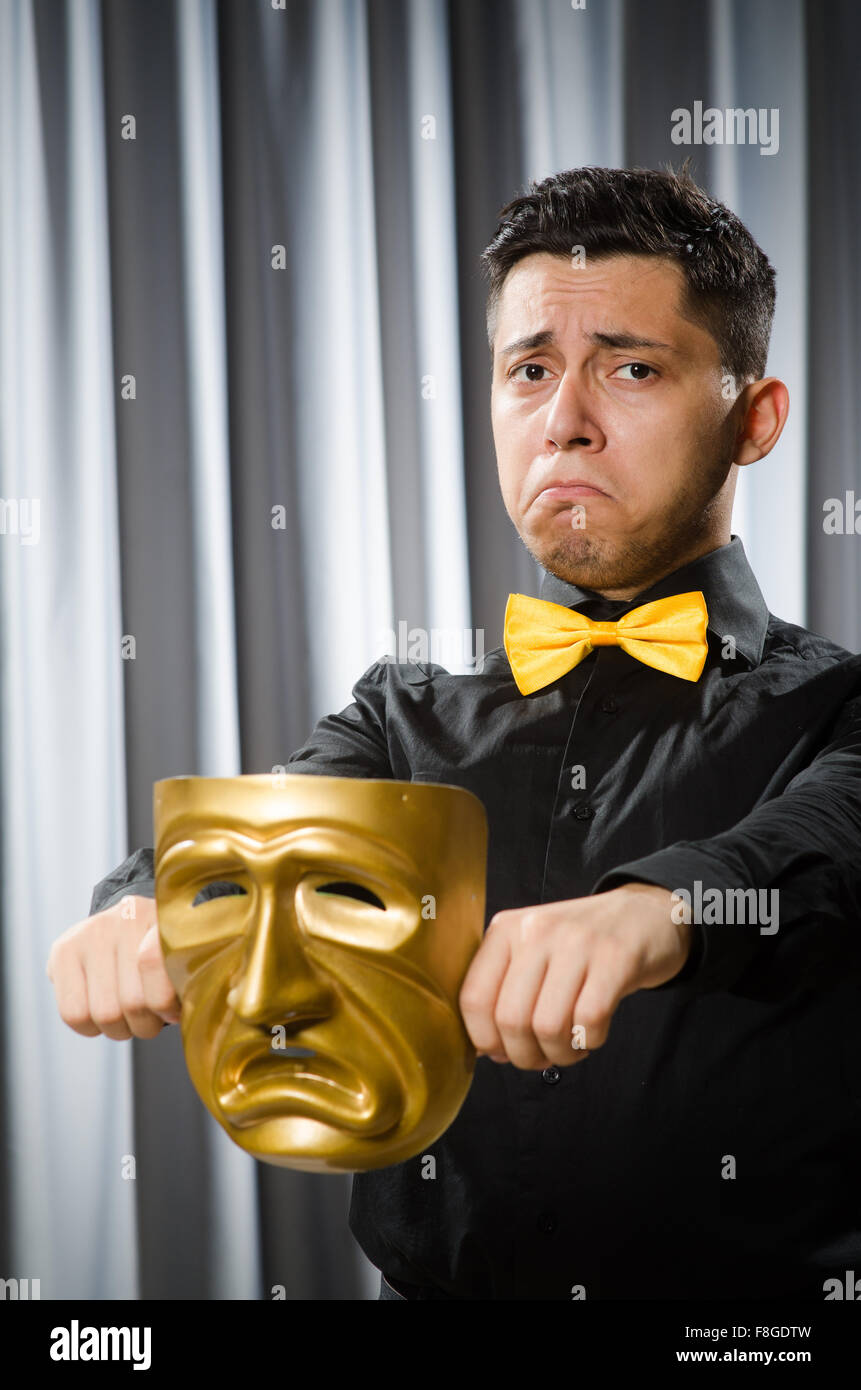 Funny concept with theatrical mask Stock Photo - Alamy