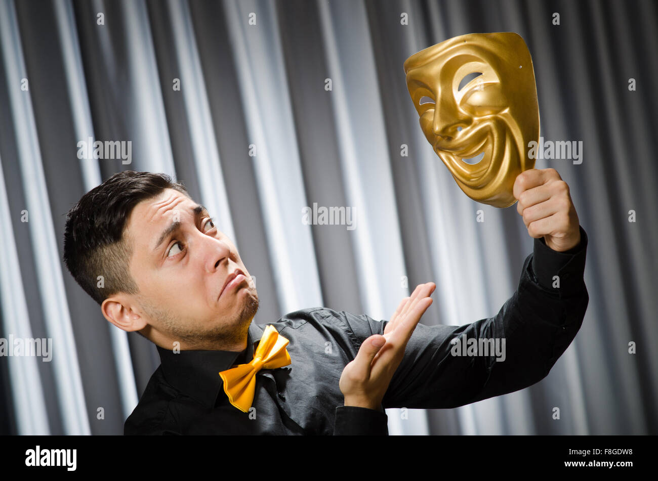 Funny concept with theatrical mask Stock Photo - Alamy