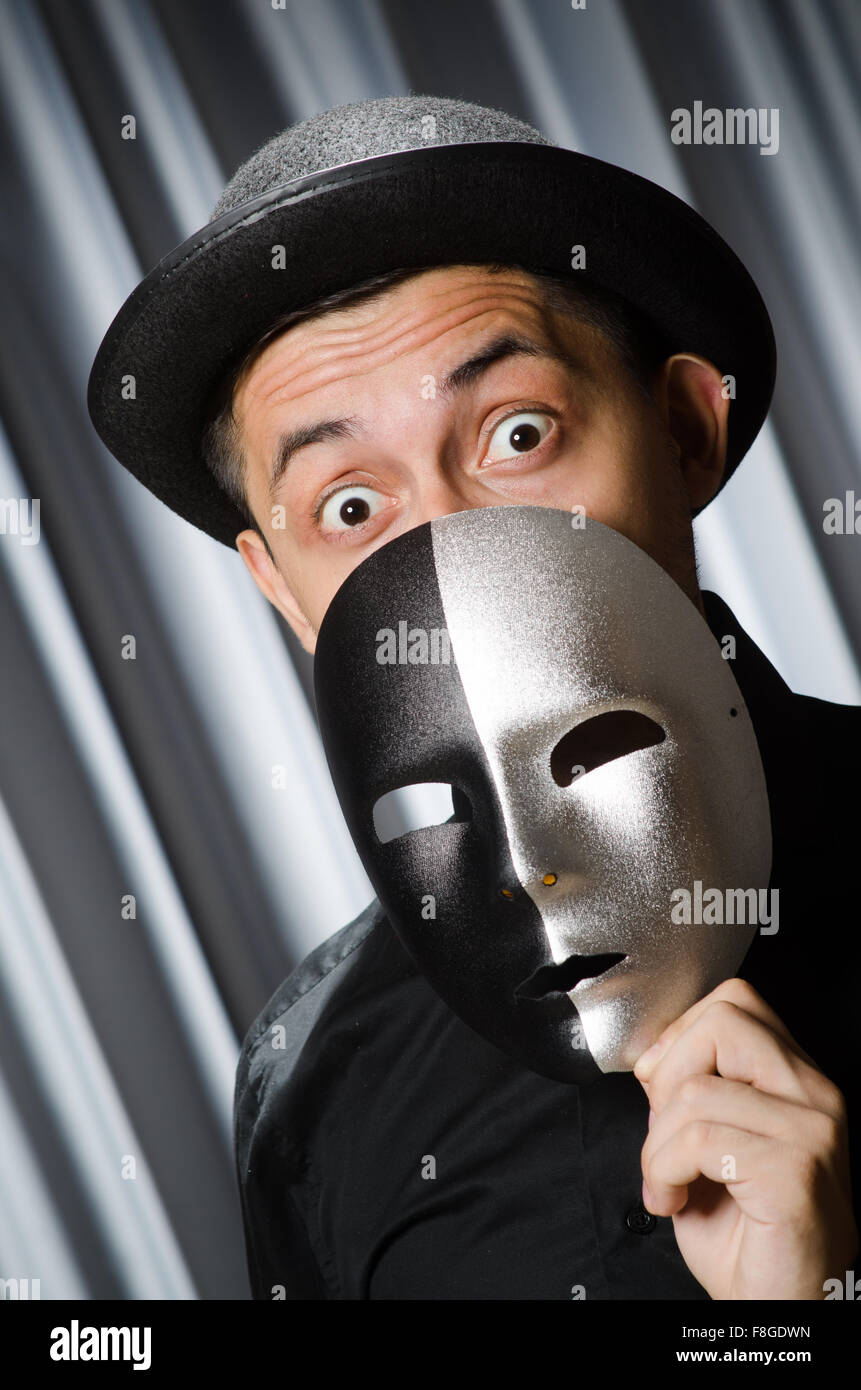 Funny concept with theatrical mask Stock Photo - Alamy