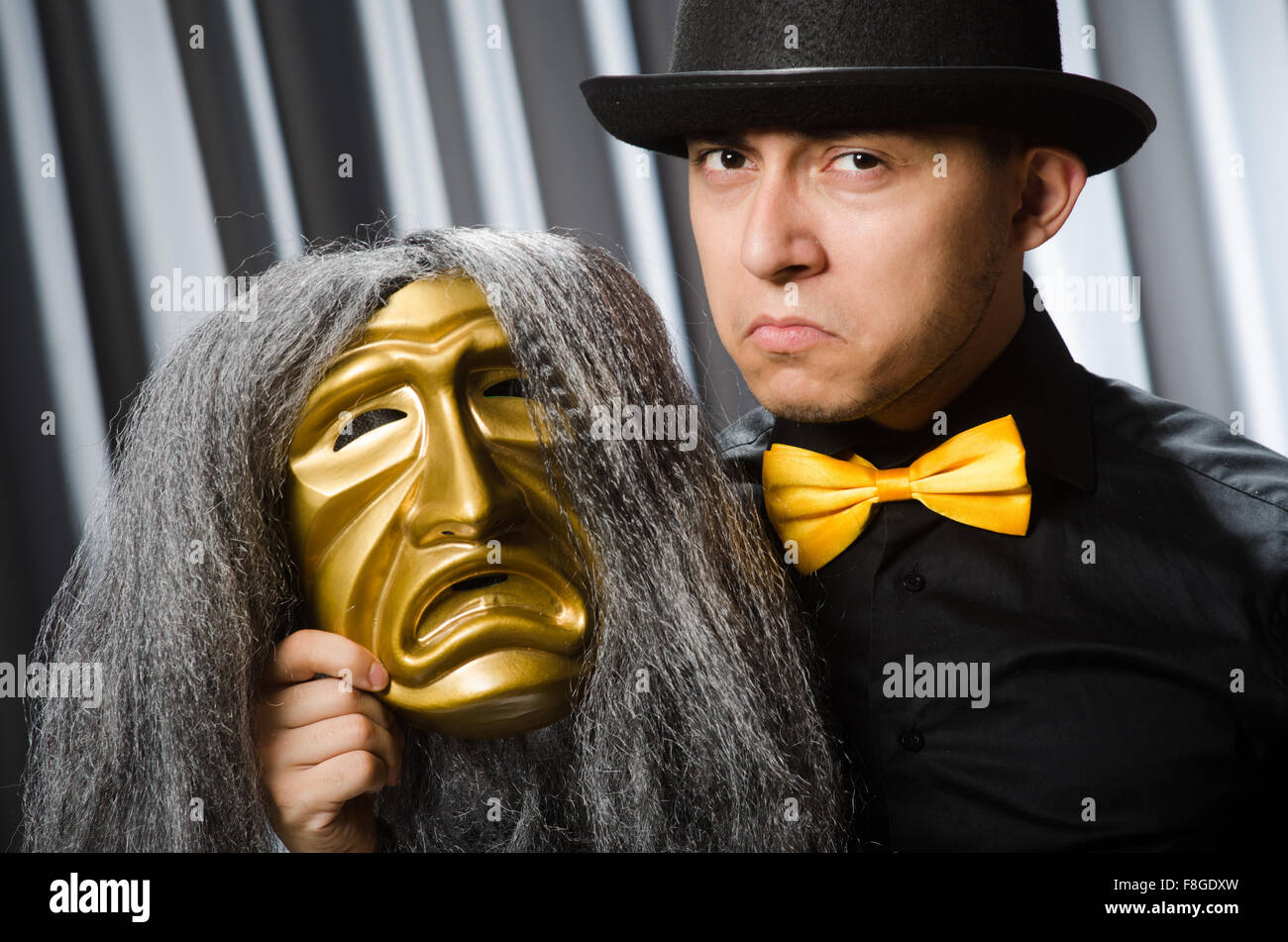 Funny concept with theatrical mask Stock Photo - Alamy