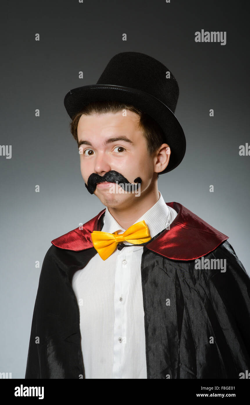 Funny magician with wand and hat Stock Photo - Alamy