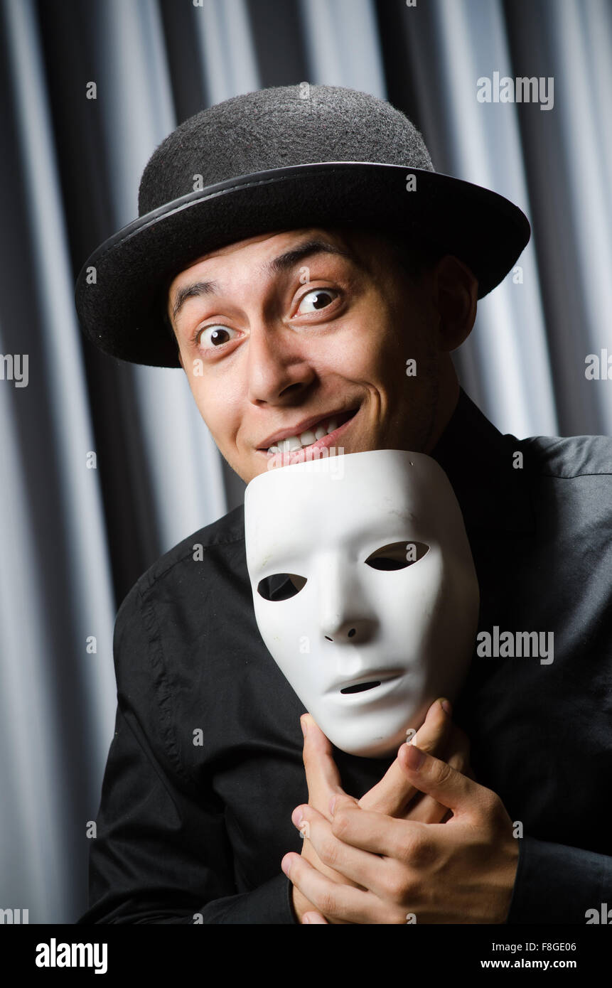 Funny concept with theatrical mask Stock Photo - Alamy