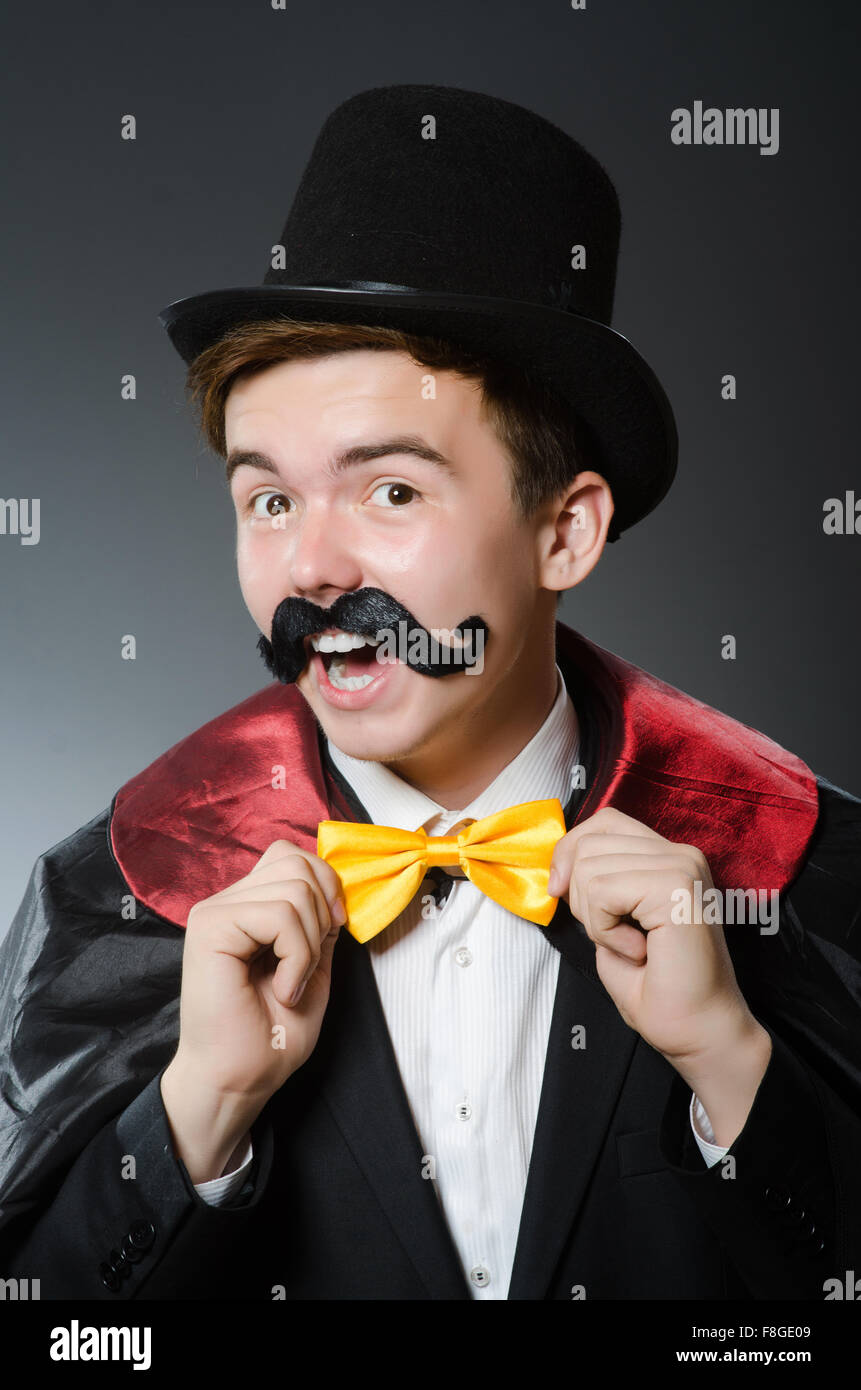 Funny magician with wand and hat Stock Photo - Alamy