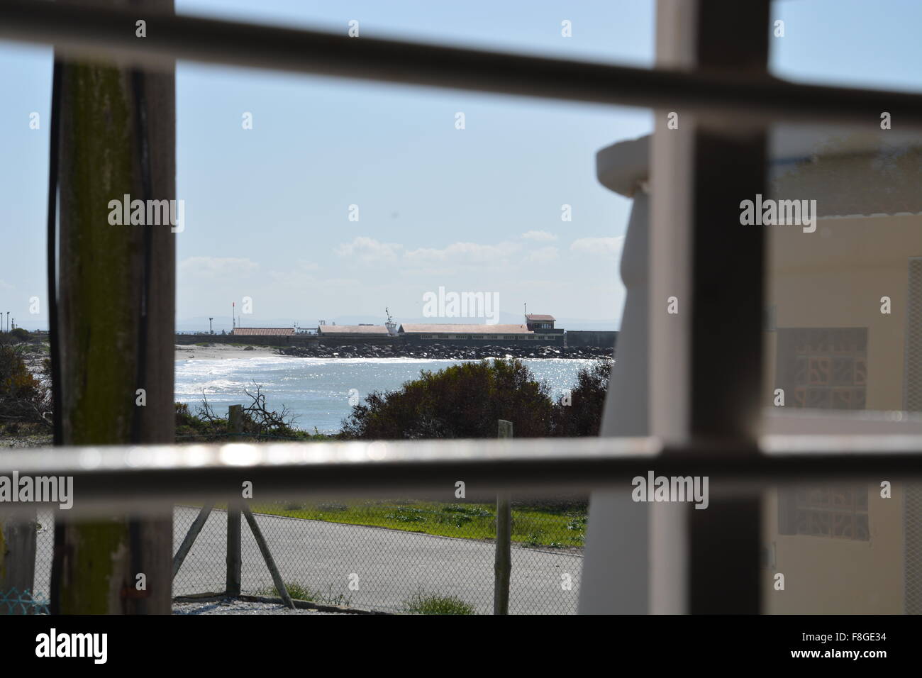 The view of Robben Island Prison through the window bars of Robert ...