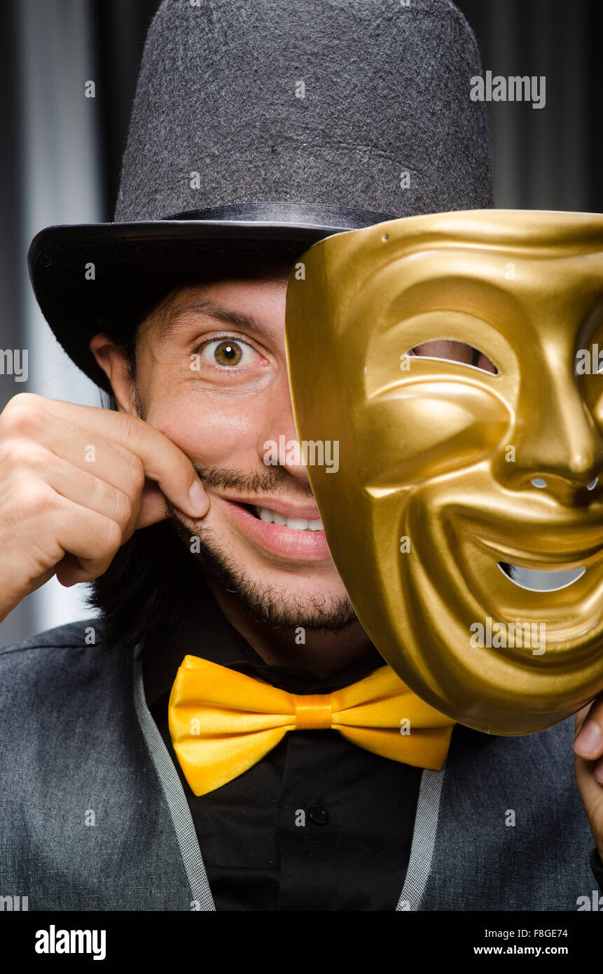 Funny concept with theatrical mask Stock Photo - Alamy