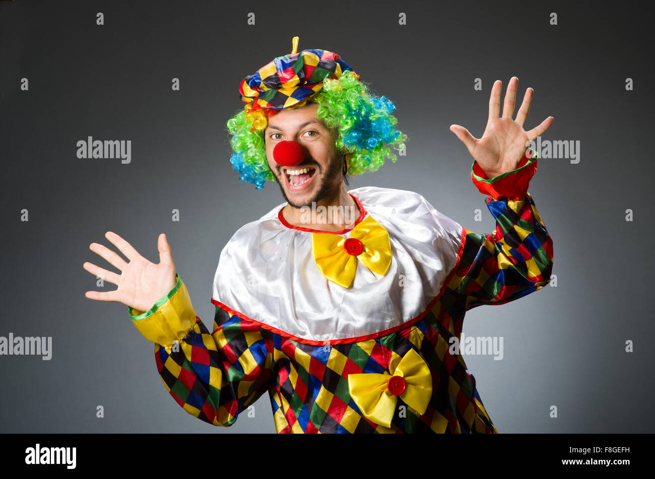 Funny clown in colourful costume Stock Photo - Alamy