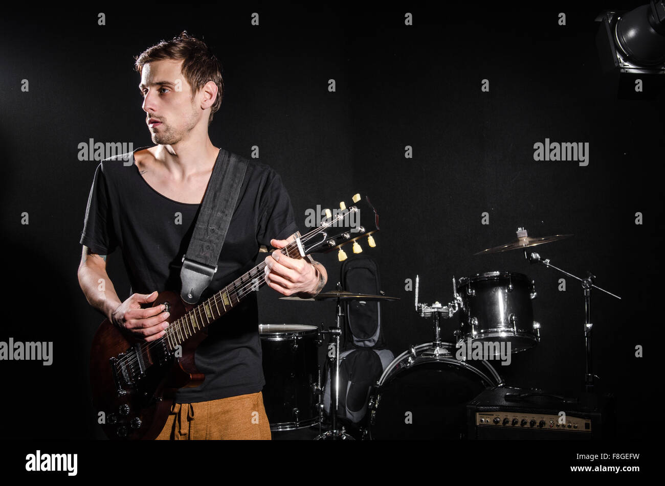 Man with guitar during concert Stock Photo - Alamy