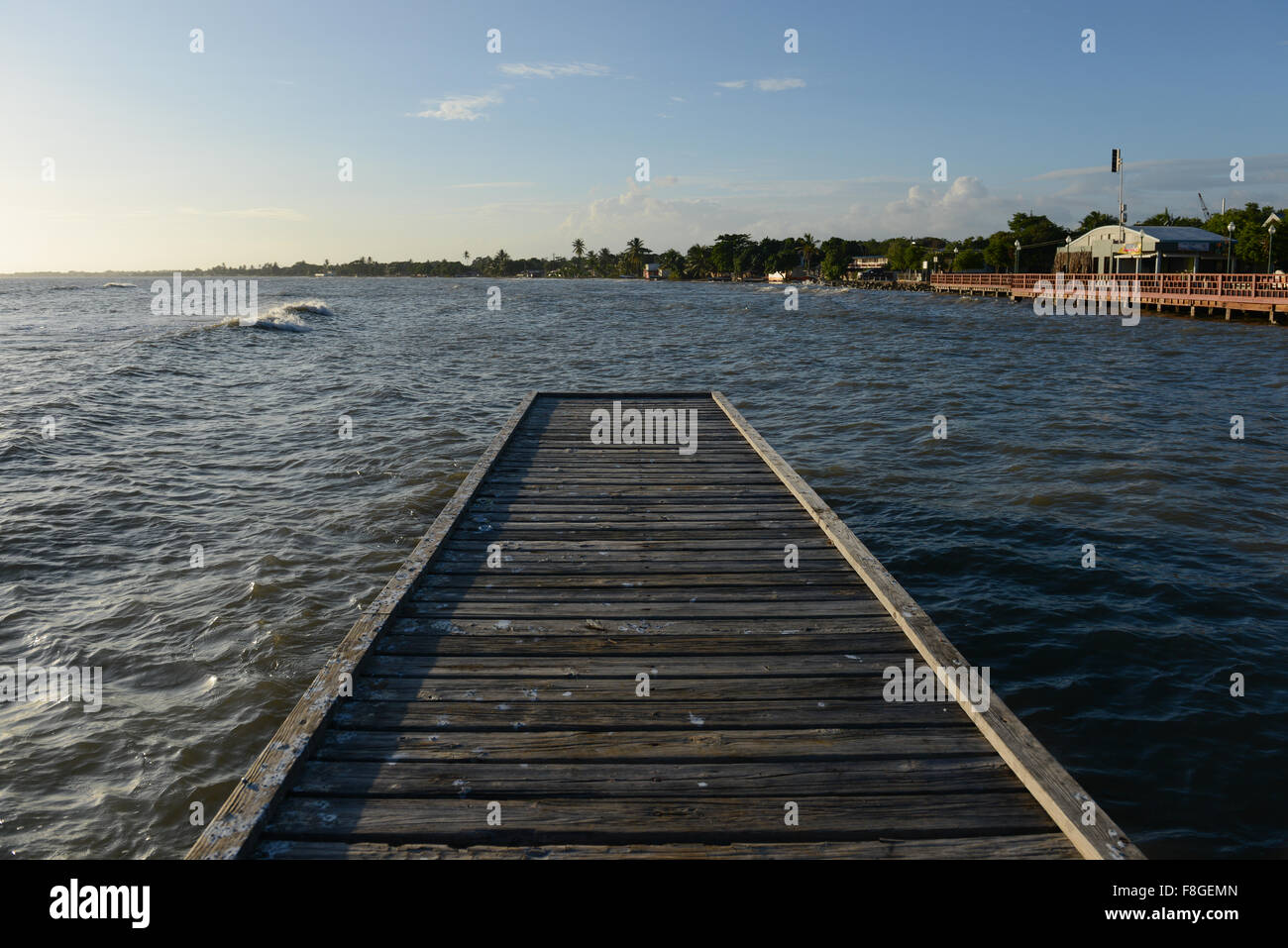Wooden pier leads to the ocean. Juana Diaz, Puerto Rico. Caribbean ...