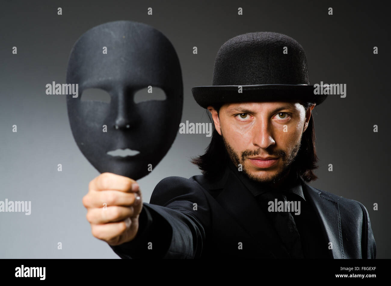 Funny concept with theatrical mask Stock Photo - Alamy