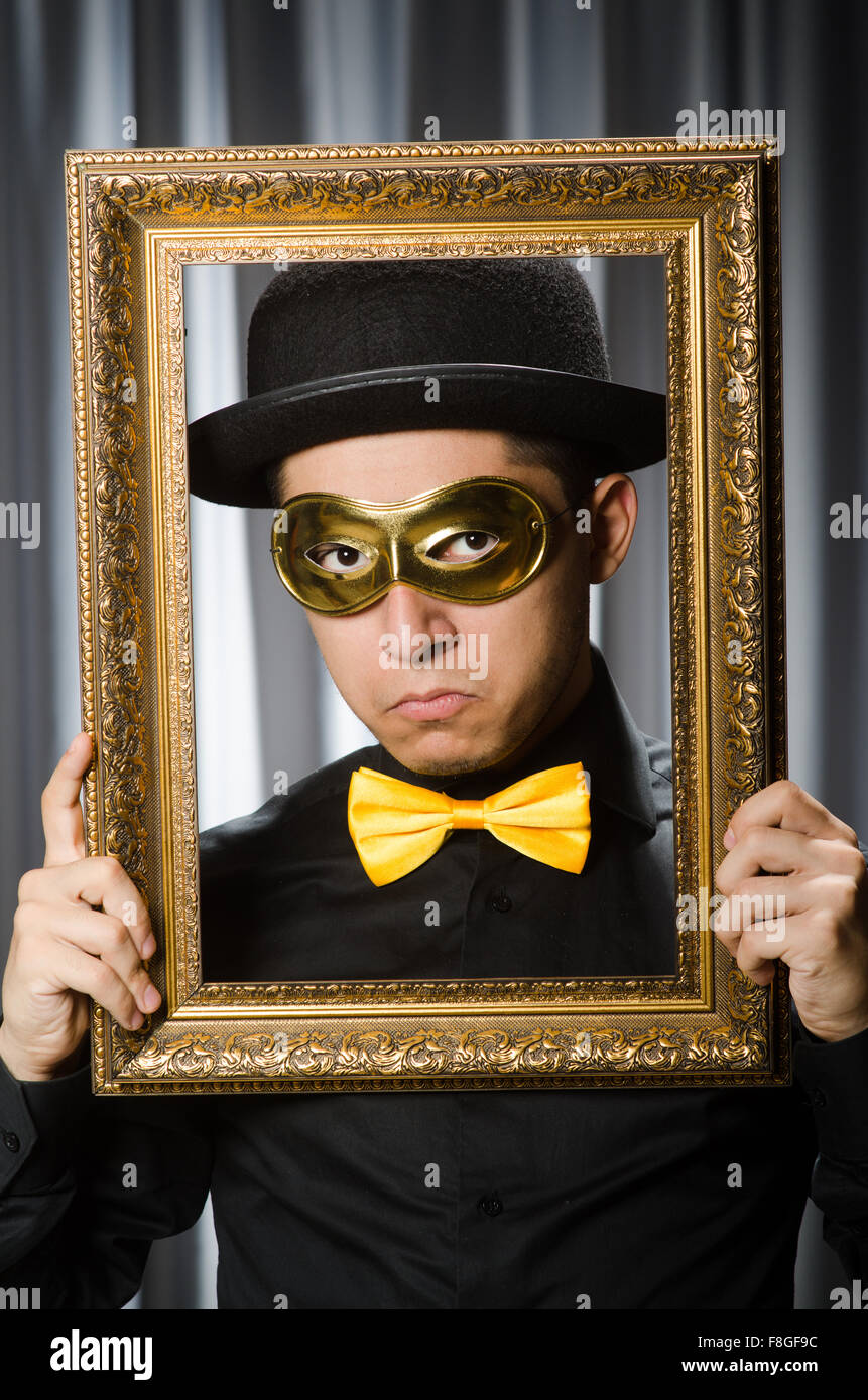 Funny concept with theatrical mask Stock Photo - Alamy