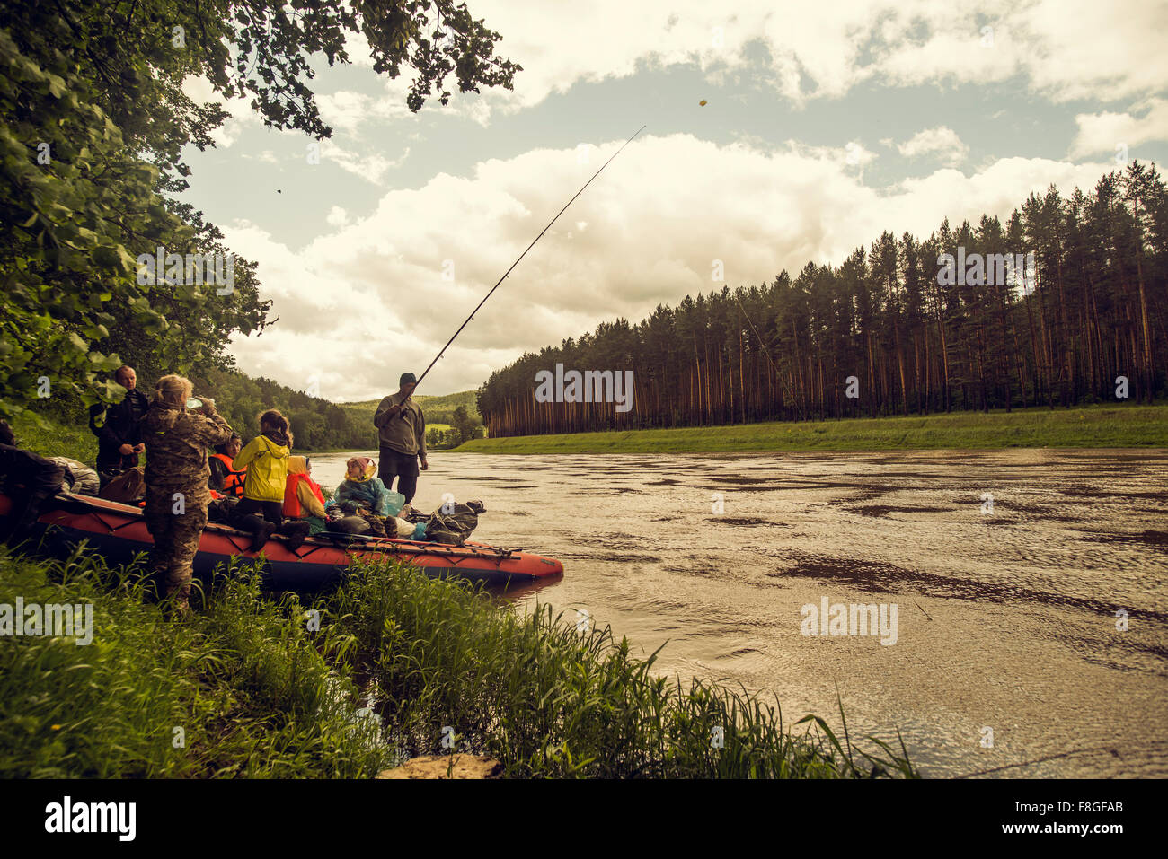 Three people fishing hi-res stock photography and images - Alamy