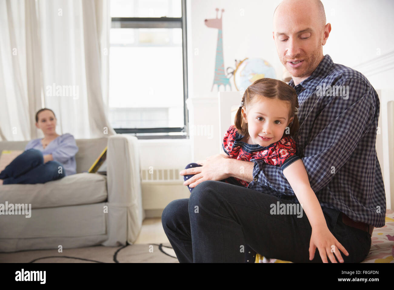 Happy father daughter sitting bed hi-res stock photography and images ...