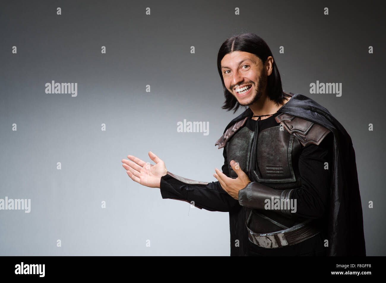 Funny knight against dark background Stock Photo - Alamy