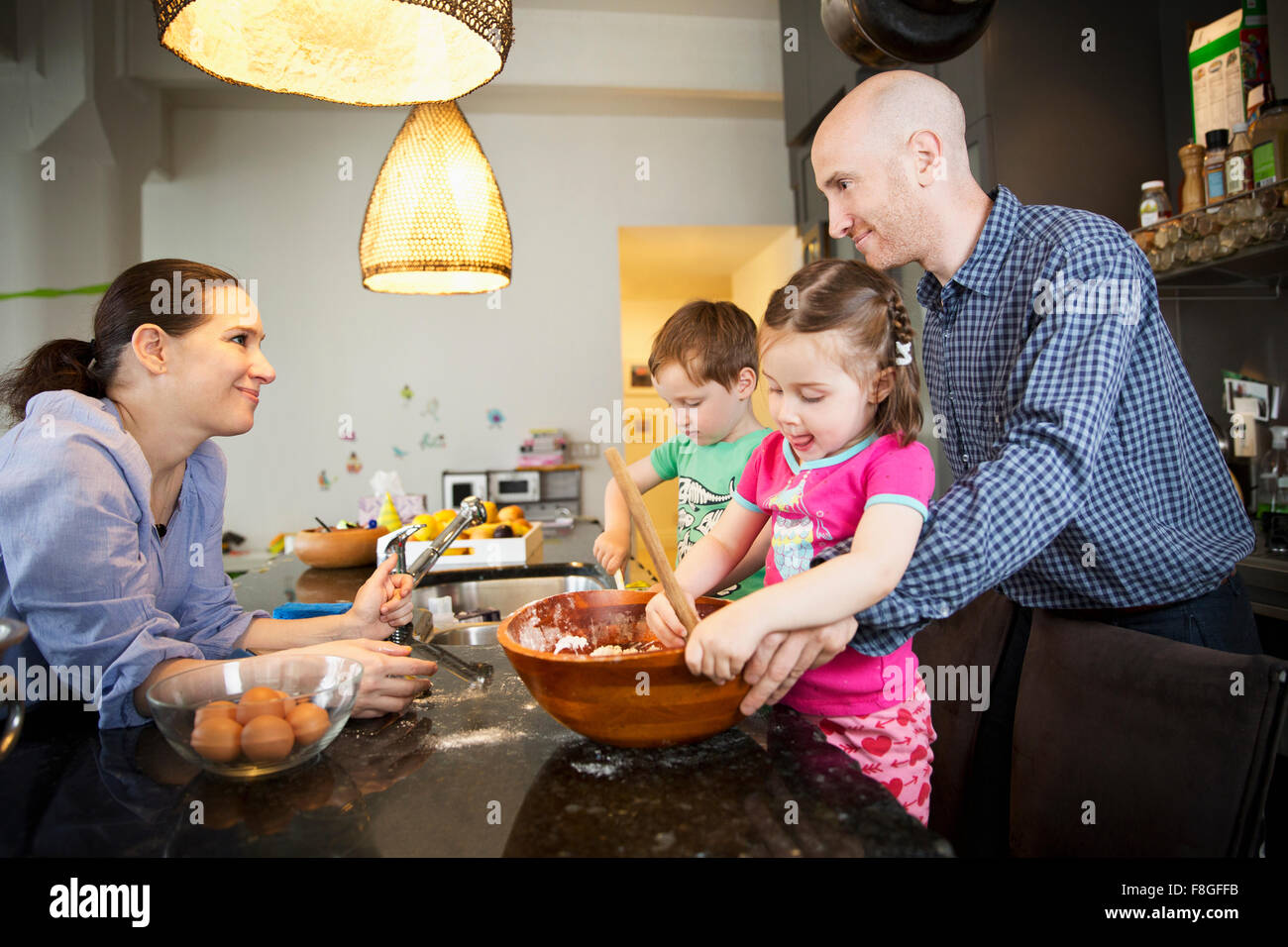 Family cooking in kitchen Stock Photo - Alamy