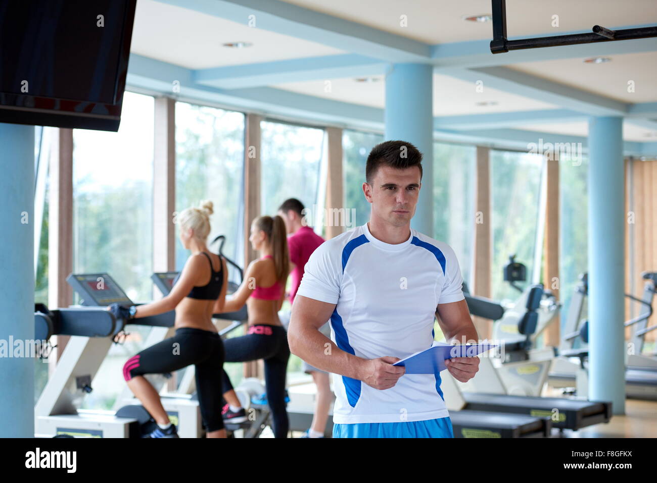 group portrait of healthy and fit young people in fitness gym Stock ...