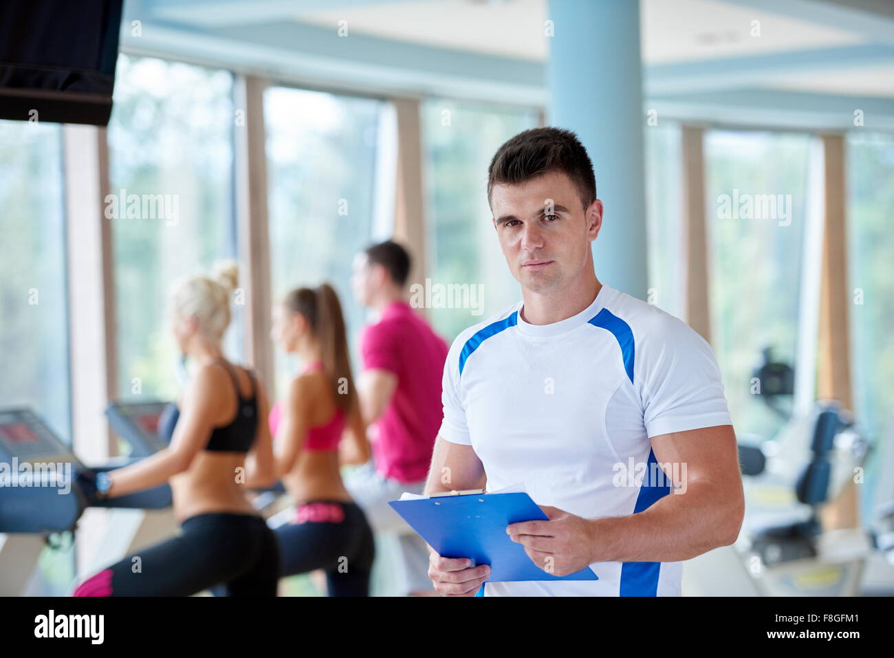 group portrait of healthy and fit young people in fitness gym Stock ...