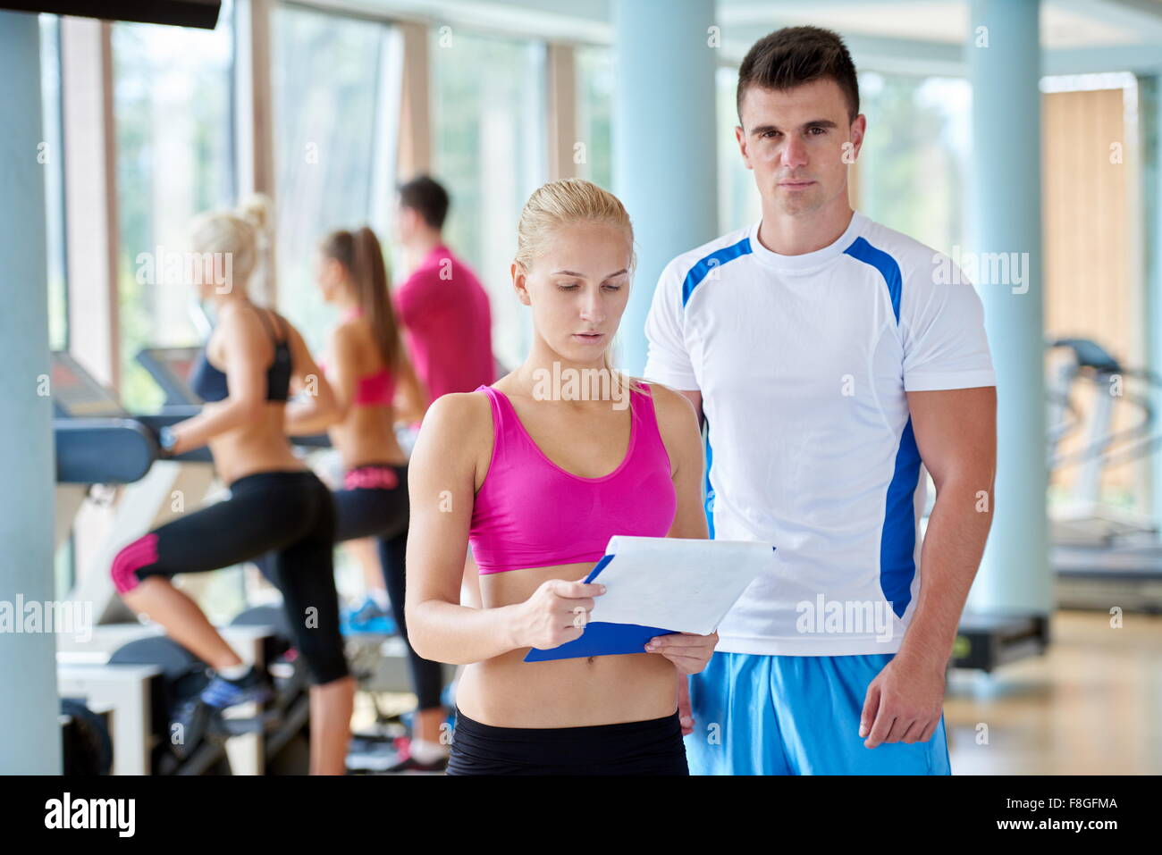 group portrait of healthy and fit young people in fitness gym Stock ...