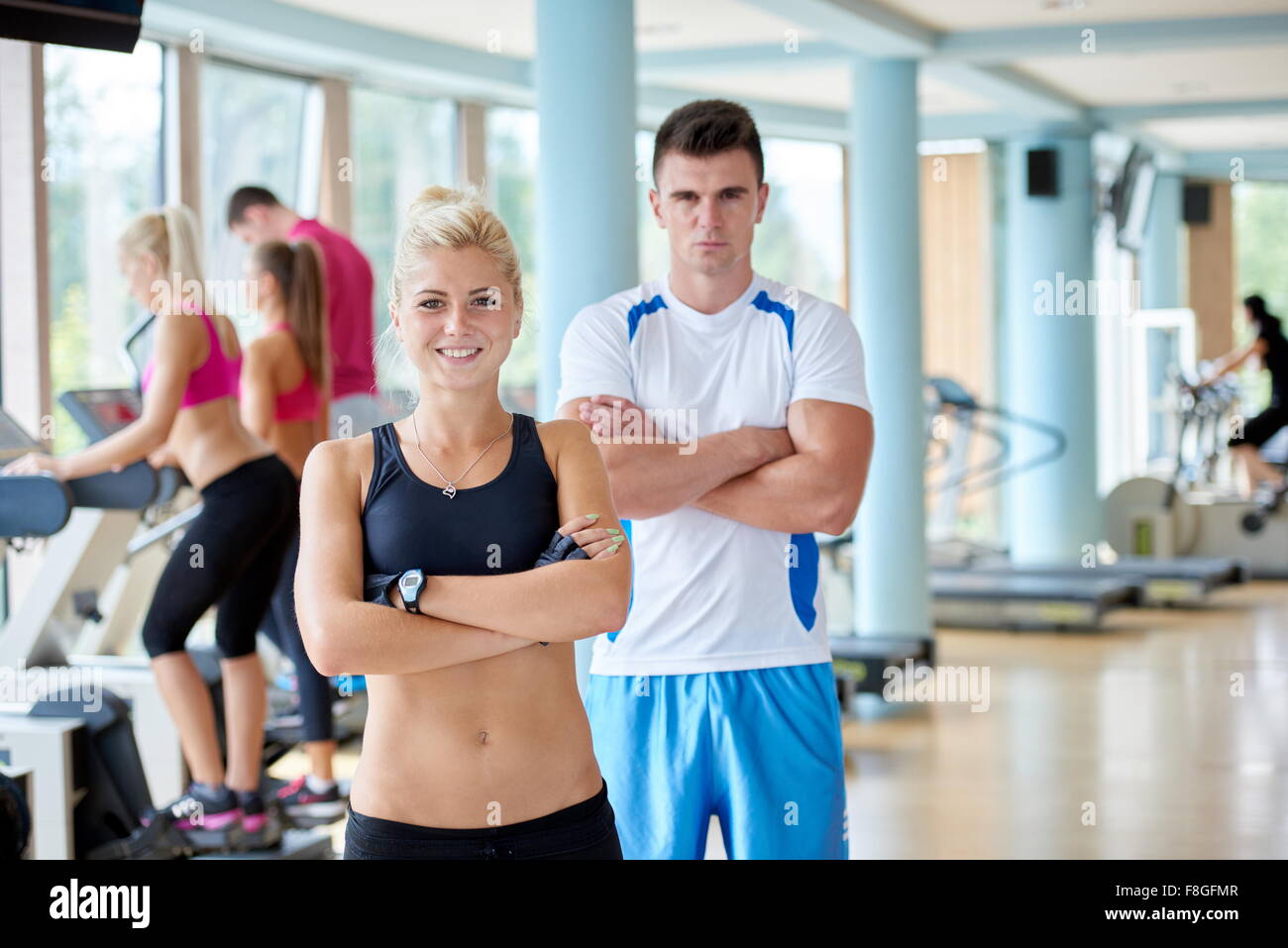 group portrait of healthy and fit young people in fitness gym Stock ...