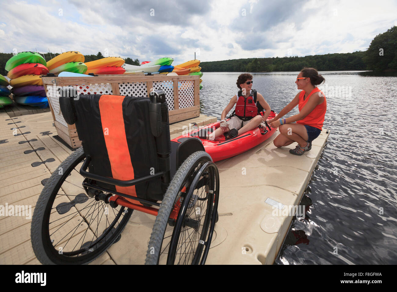 Woman with kayak wheelchair hi-res stock photography and images - Alamy