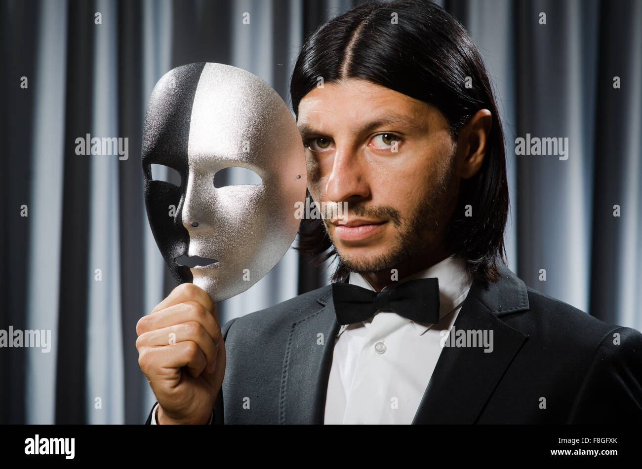 Funny concept with theatrical mask Stock Photo - Alamy