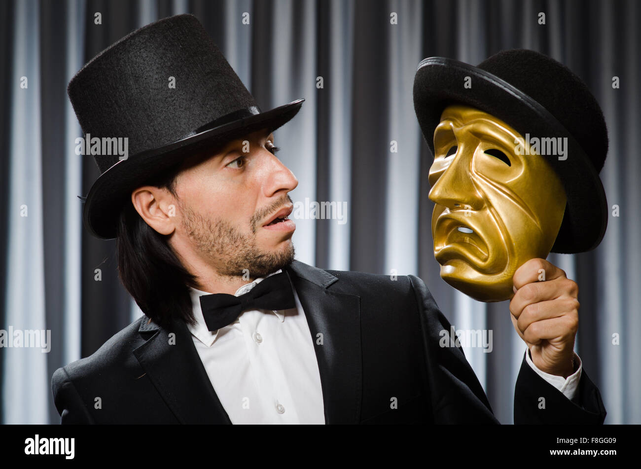 Funny concept with theatrical mask Stock Photo - Alamy