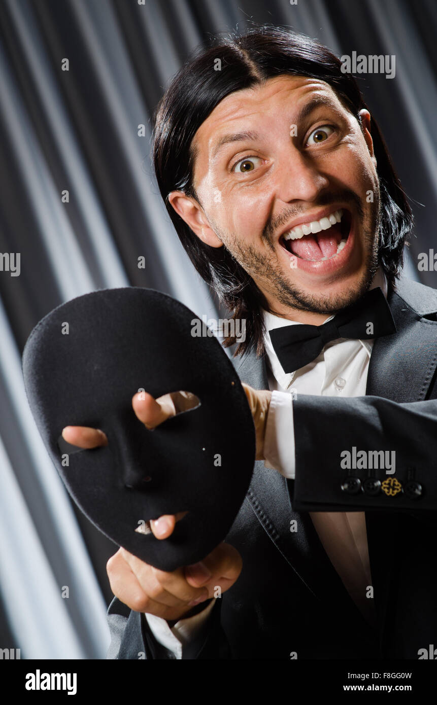 Funny concept with theatrical mask Stock Photo - Alamy