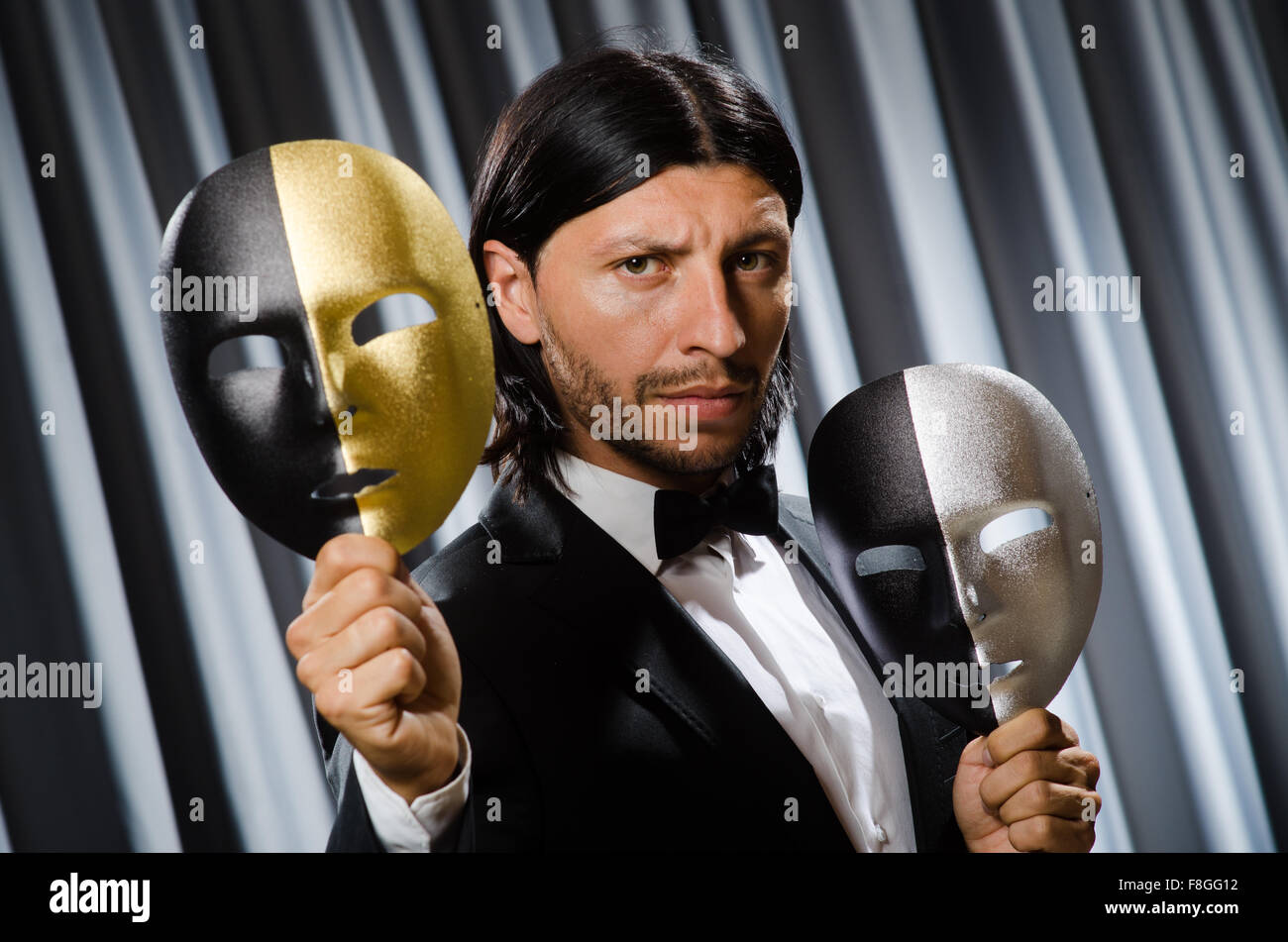 Funny concept with theatrical mask Stock Photo - Alamy