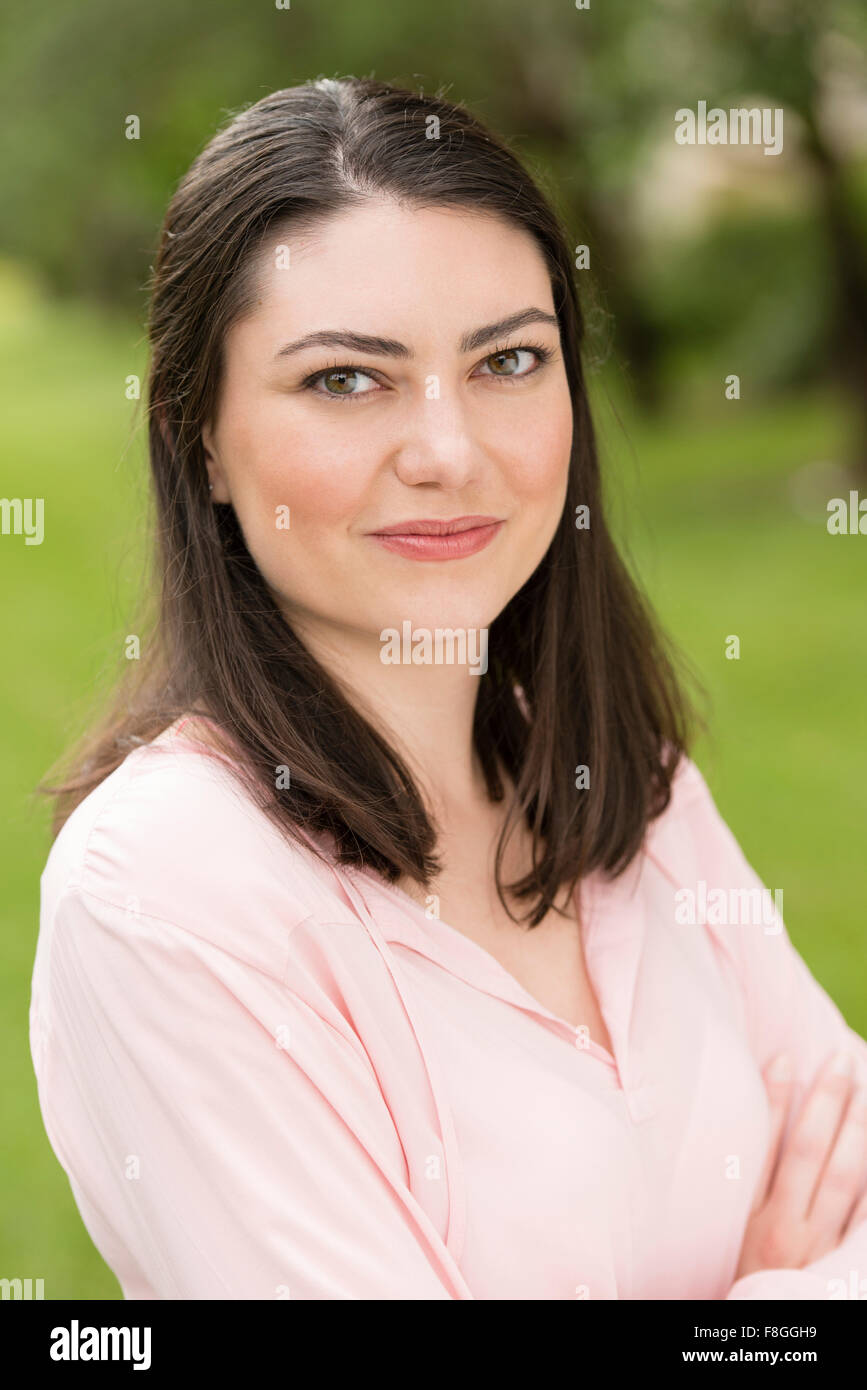 Hispanic woman smiling outdoors Stock Photo - Alamy
