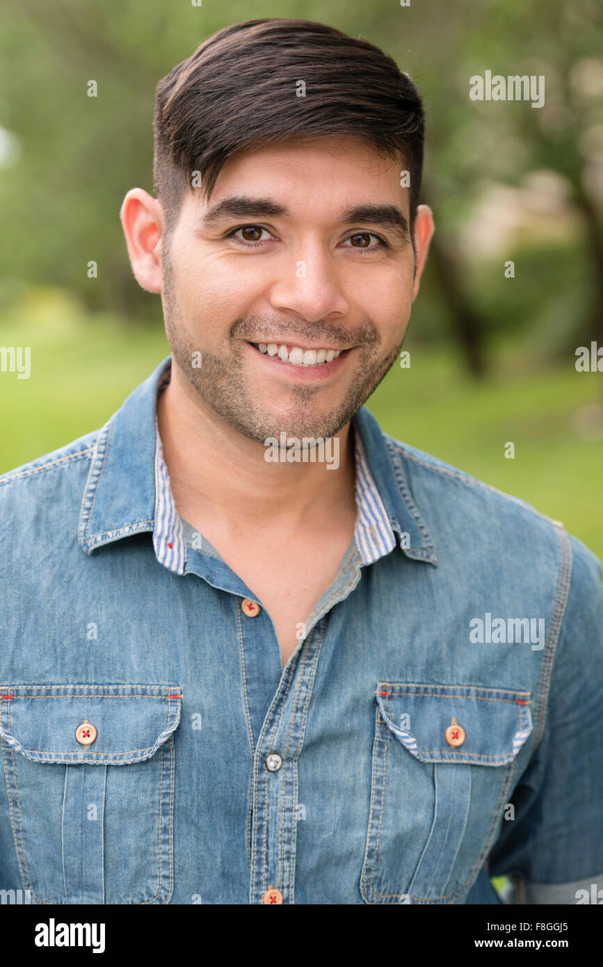 Hispanic man smiling outdoors Stock Photo - Alamy