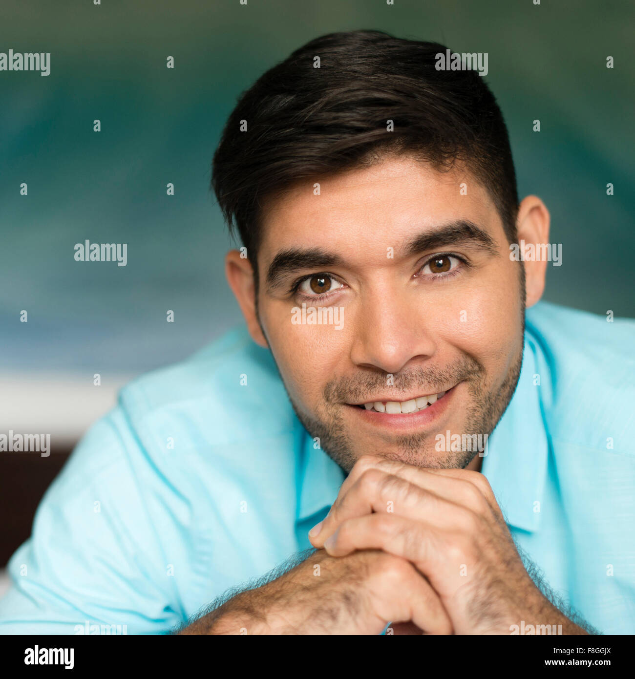 Hispanic man smiling Stock Photo - Alamy