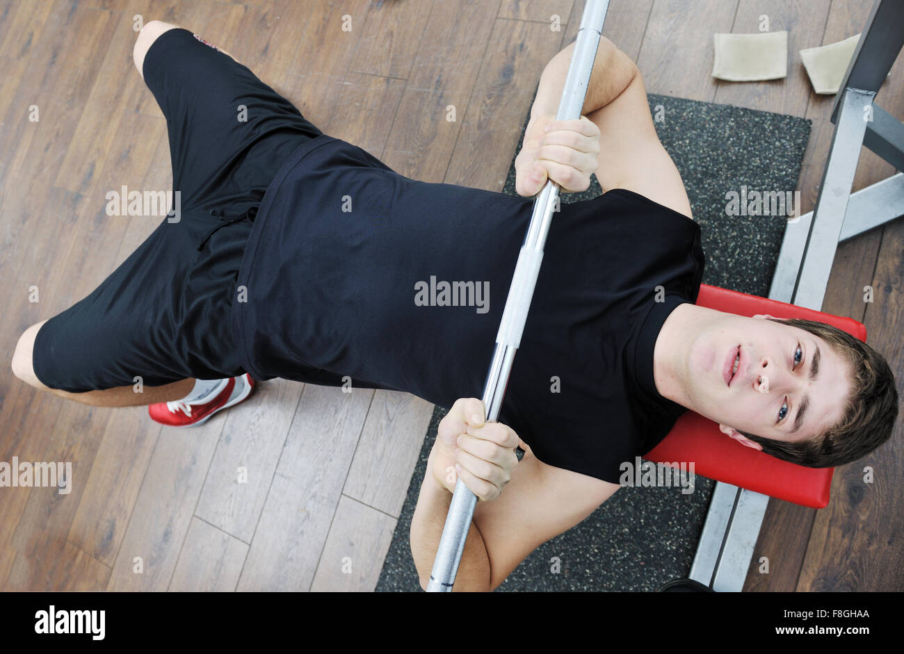 young man in fintess sport club exercise withweights and relaxing Stock ...