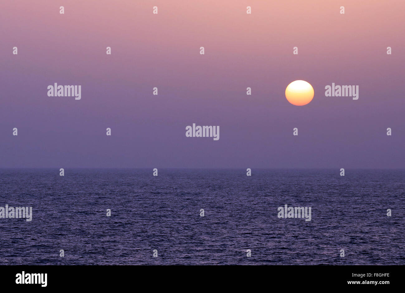 Sunset over the ocean Stock Photo - Alamy