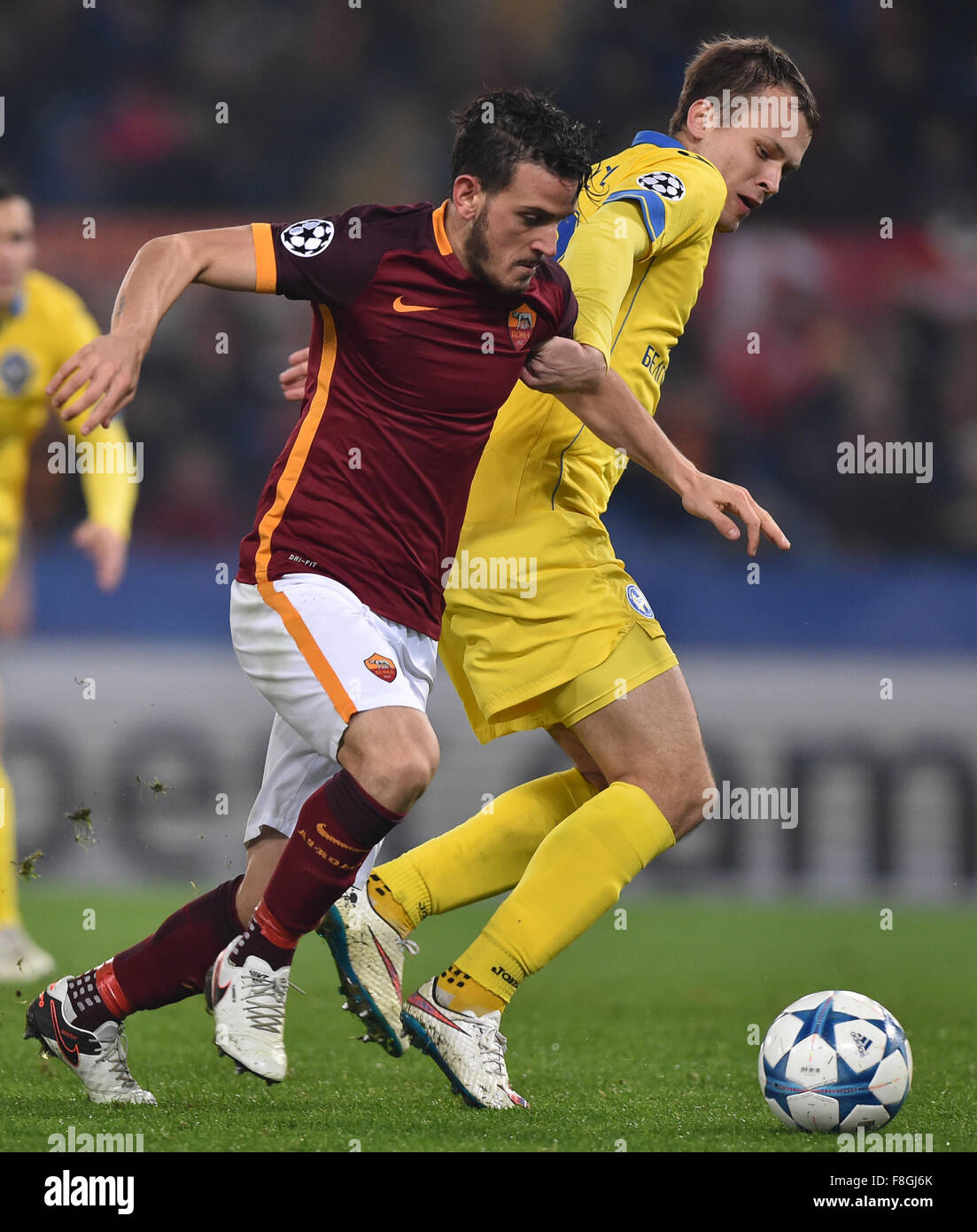Rome, Italy. 10th Dec, 2015. Alessandro Florenzi (L) of Roma vies with Denis Polyakov of Bate ...