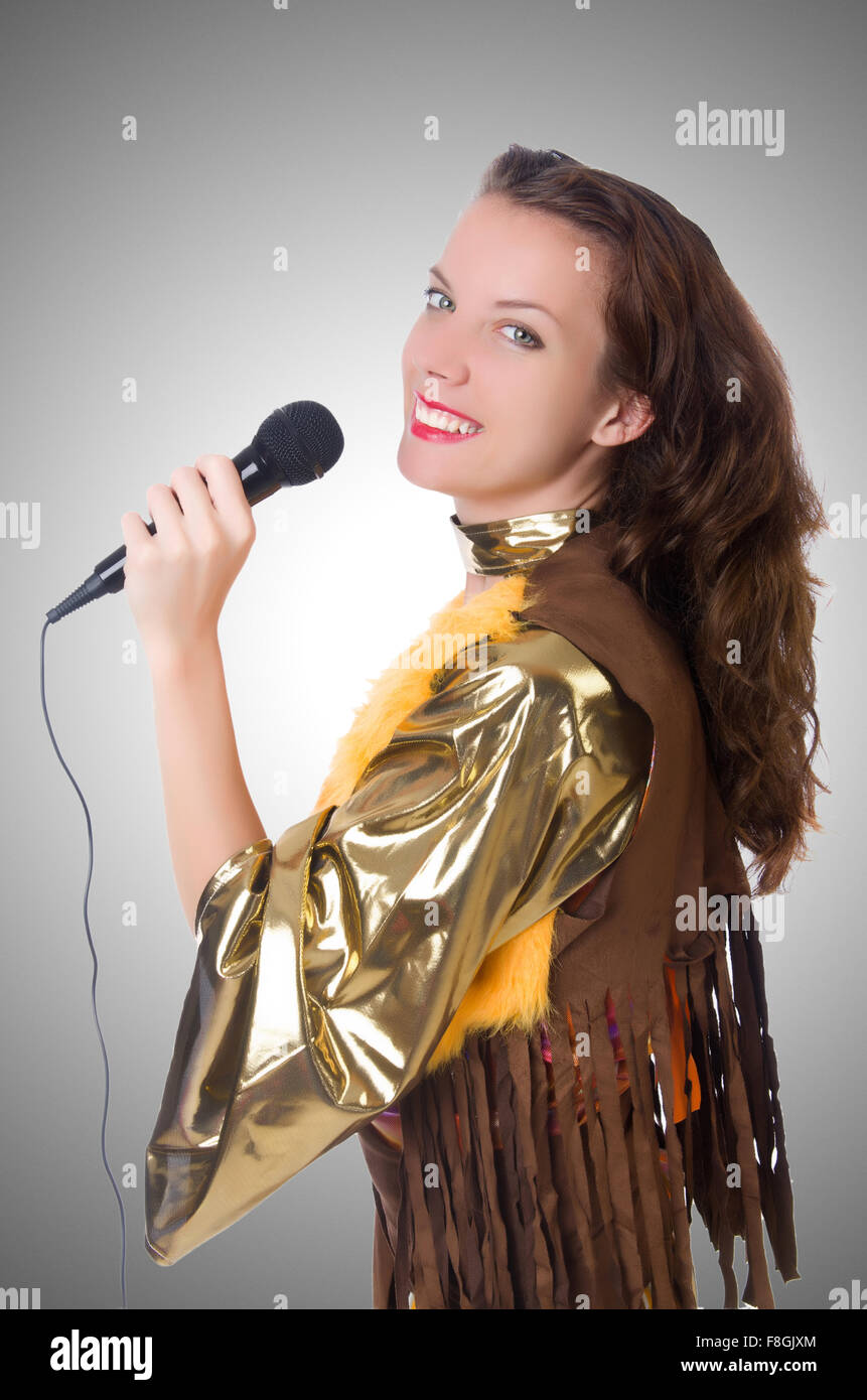Woman in spanish clothing with mic Stock Photo - Alamy