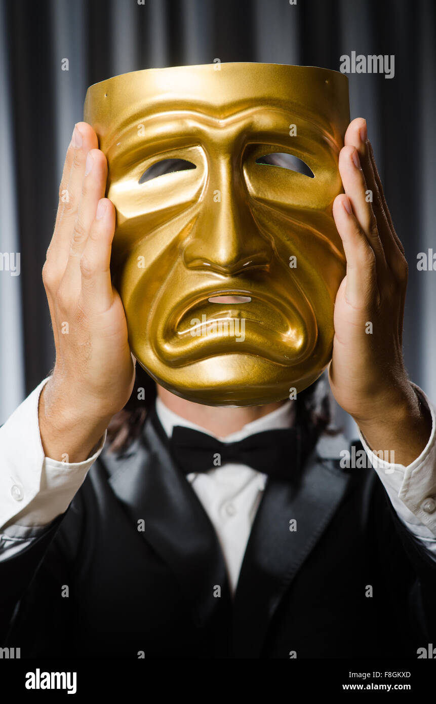 Funny concept with theatrical mask Stock Photo - Alamy