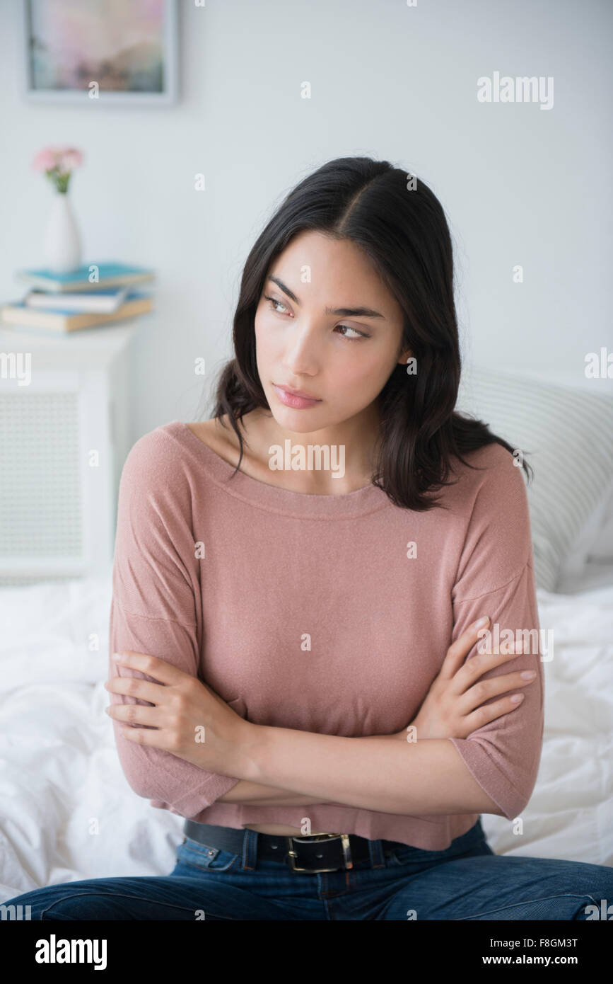 Young latina woman sitting hi-res stock photography and images - Alamy