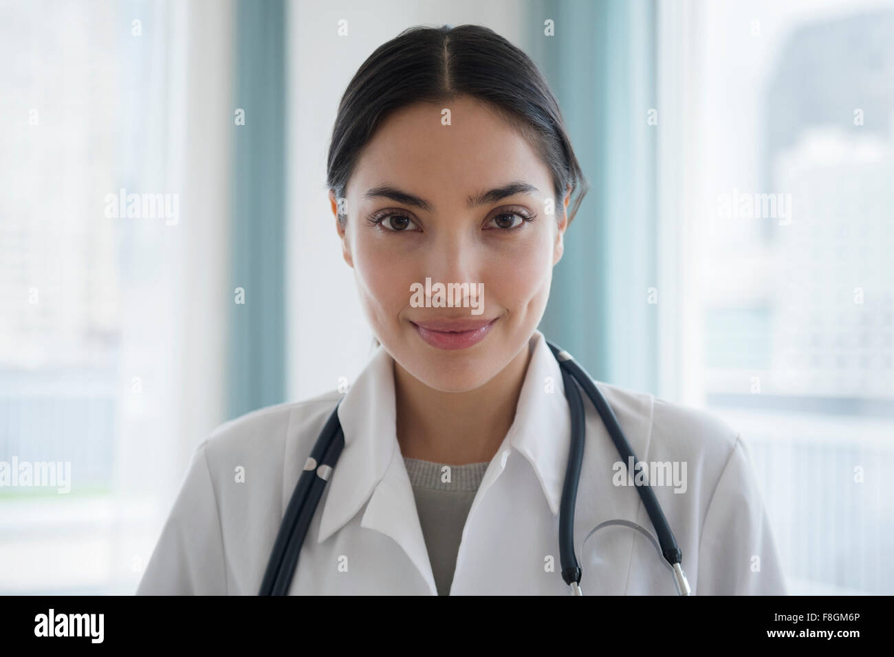 Hispanic doctor smiling Stock Photo - Alamy