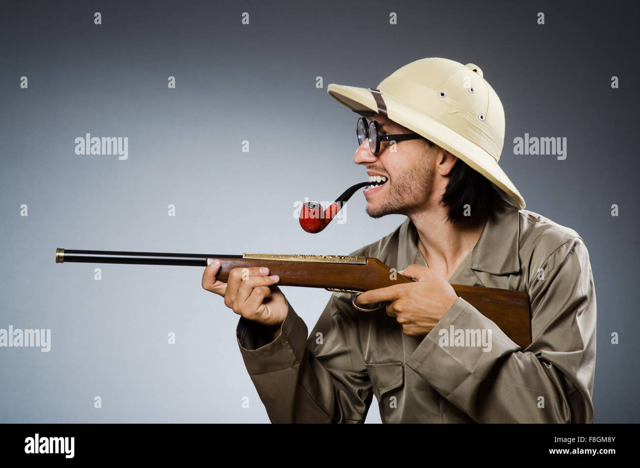 Hunter with rifle and smoking pipe Stock Photo - Alamy