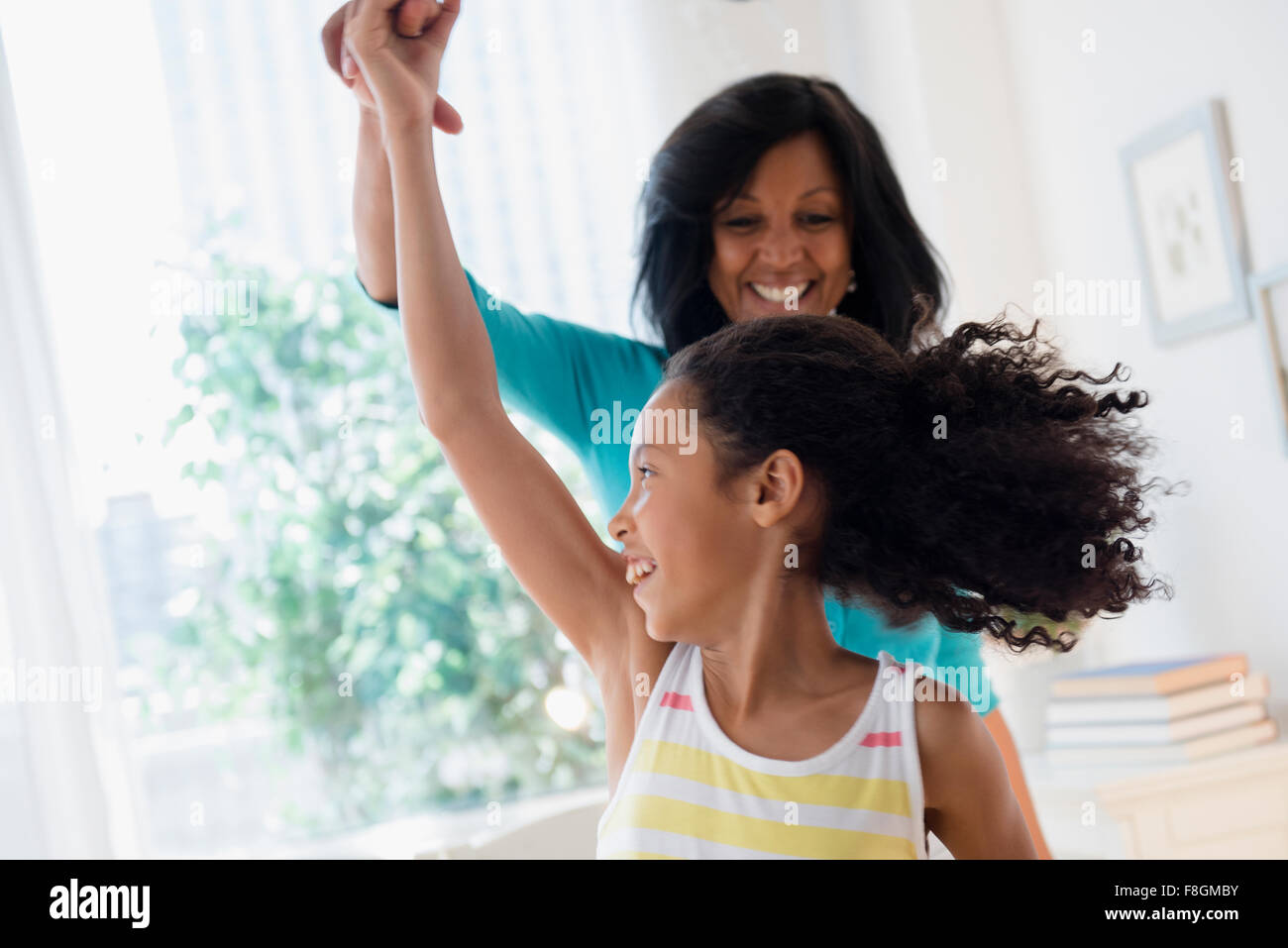 Mother and daughter dancing Stock Photo - Alamy