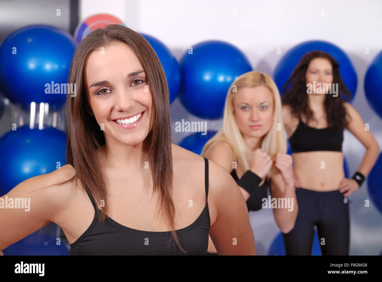 pretty girls working out in a fitness club Stock Photo - Alamy