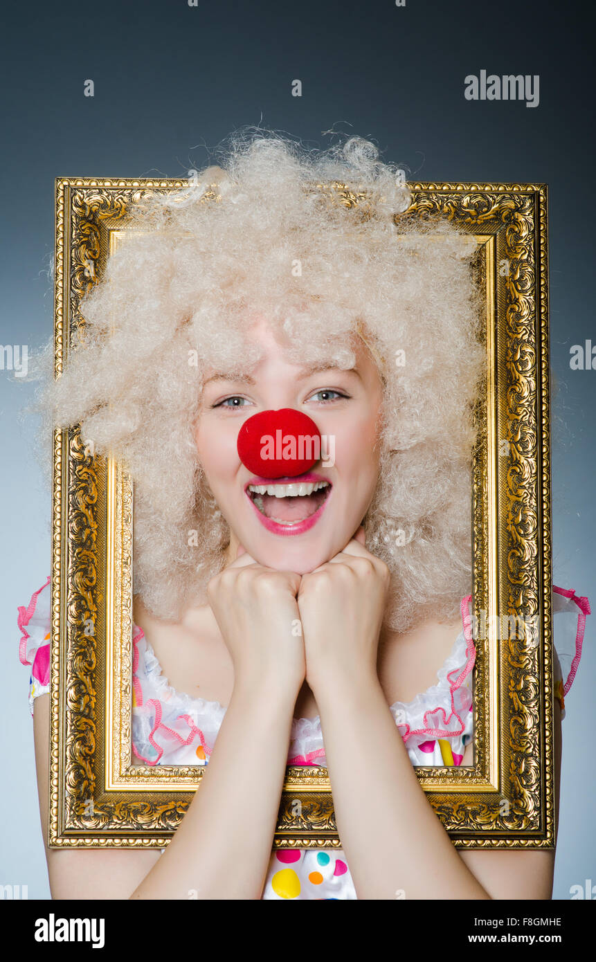 Funny clown with picture frame Stock Photo - Alamy