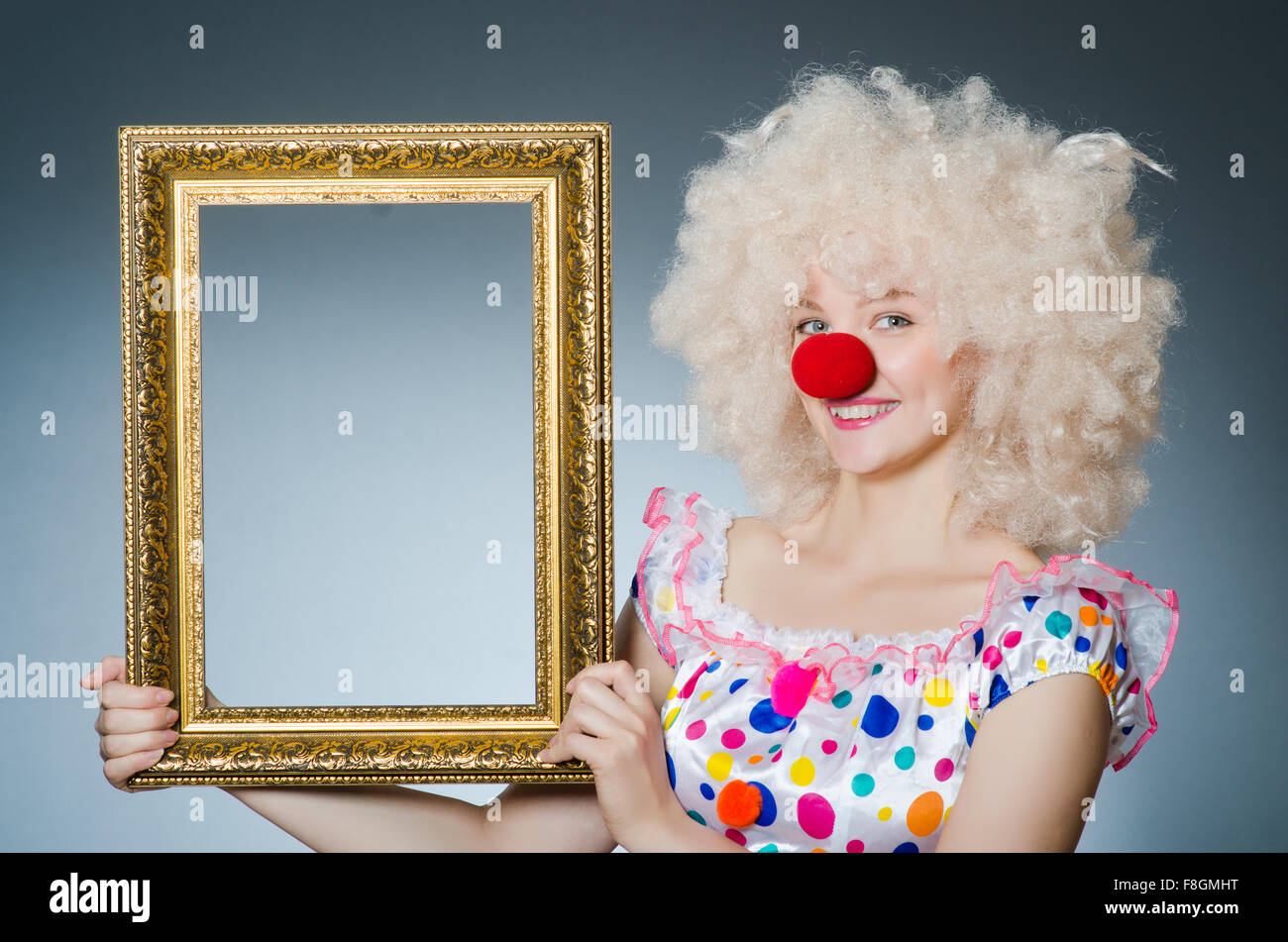 Funny clown with picture frame Stock Photo - Alamy