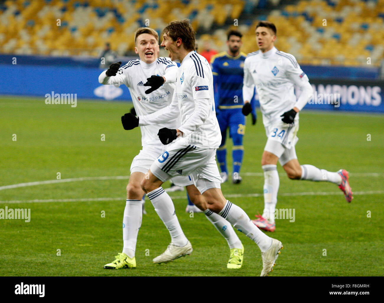 Kiev, Ukraine. 09th Dec, 2015. Denys Garmash (2-L) of Dynamocelebrate a ...