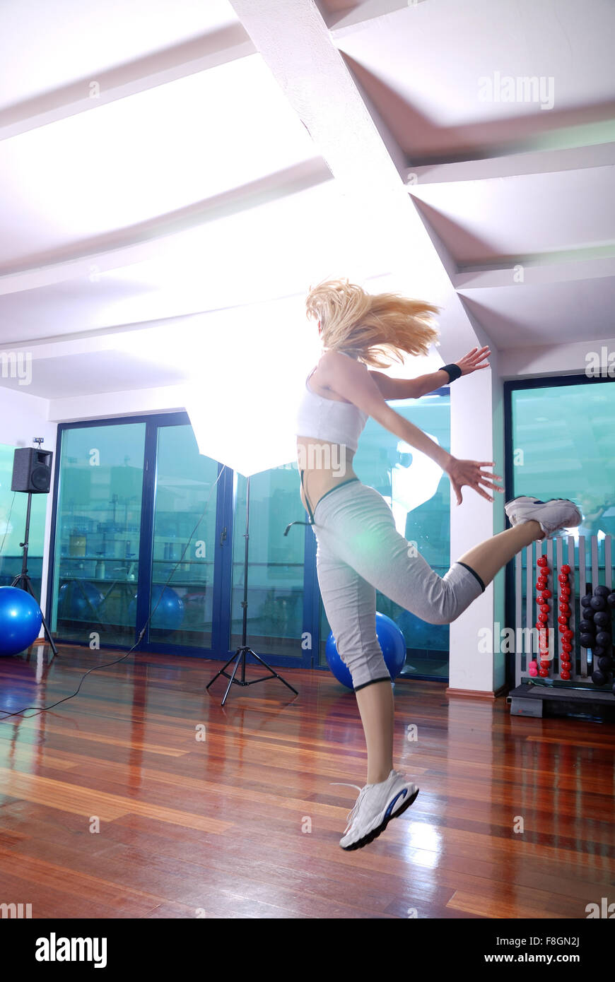 healthy girl jumping in fitness club Stock Photo - Alamy
