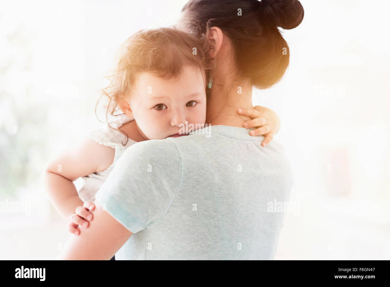 Rear view mother hugging hi-res stock photography and images - Alamy